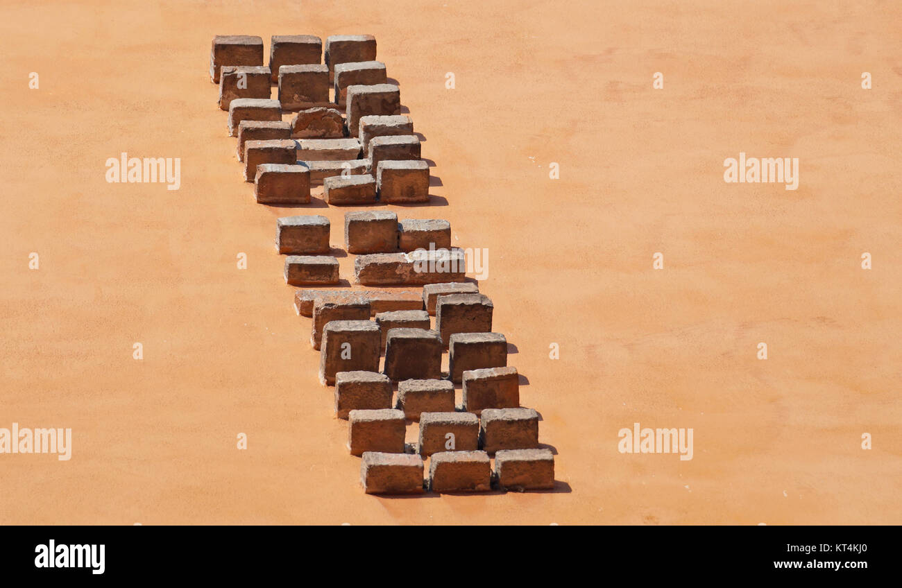 Close up of industrial bricklayer installing bricks on construction ...