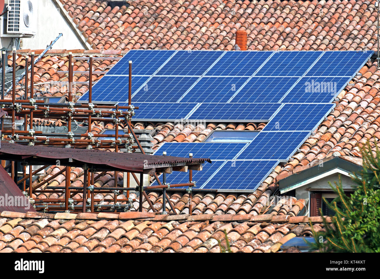 photovoltaic solar panels on multiple gable suburban house roof over ...