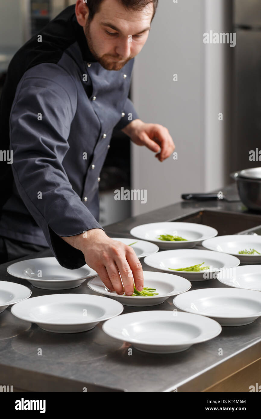 Chef making a lunch dish Stock Photo - Alamy
