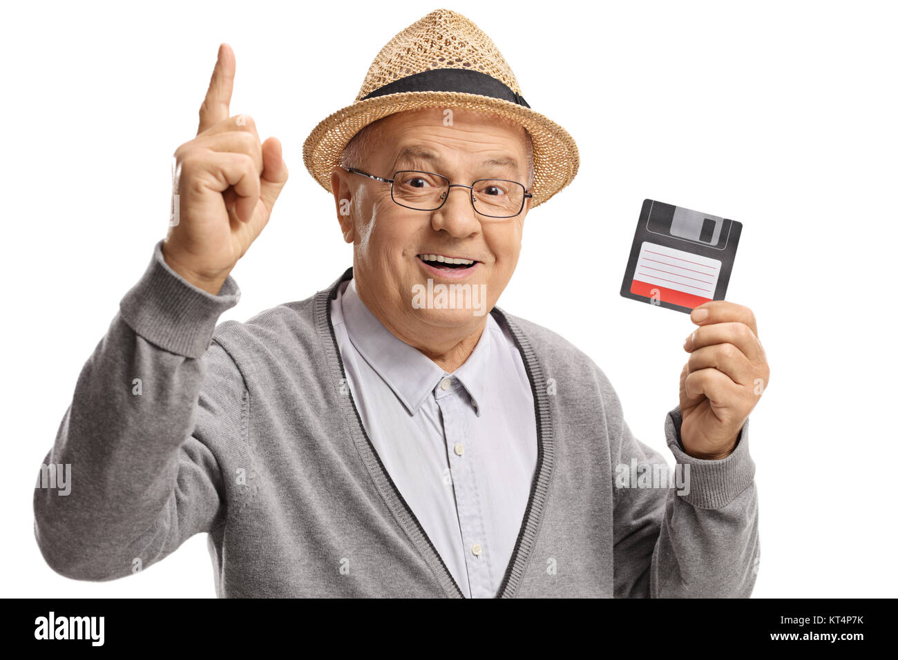 Mature man with a floppy disk holding his index finger up isolated on ...