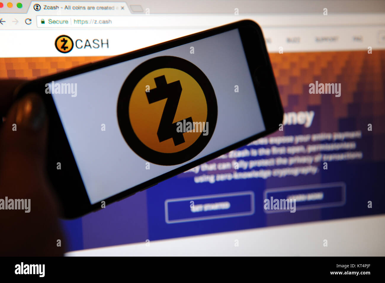 Zcash logo on a phone and on a website Stock Photo - Alamy