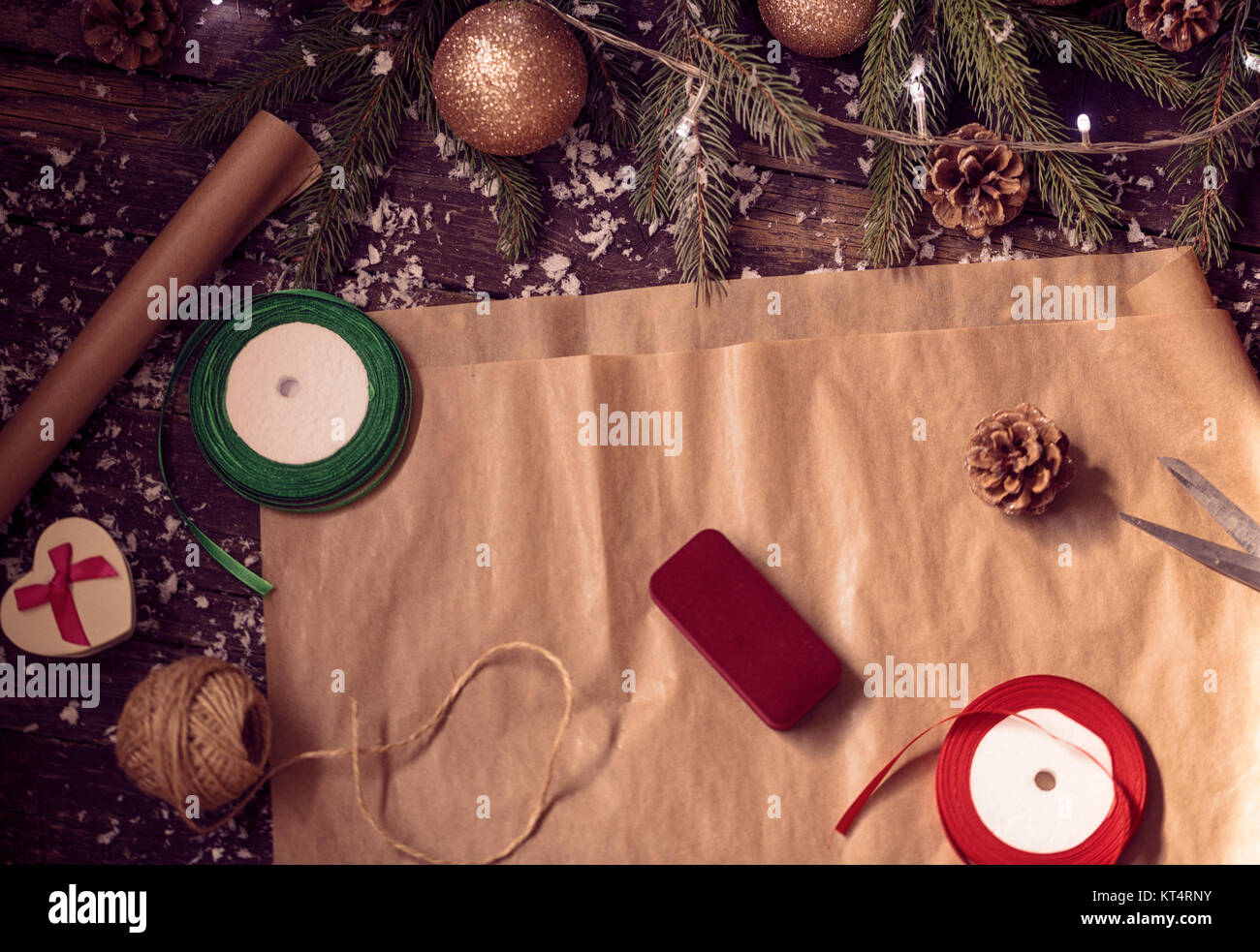 Christmas holidays background - wrapping paper, ribbon and scissors for ...