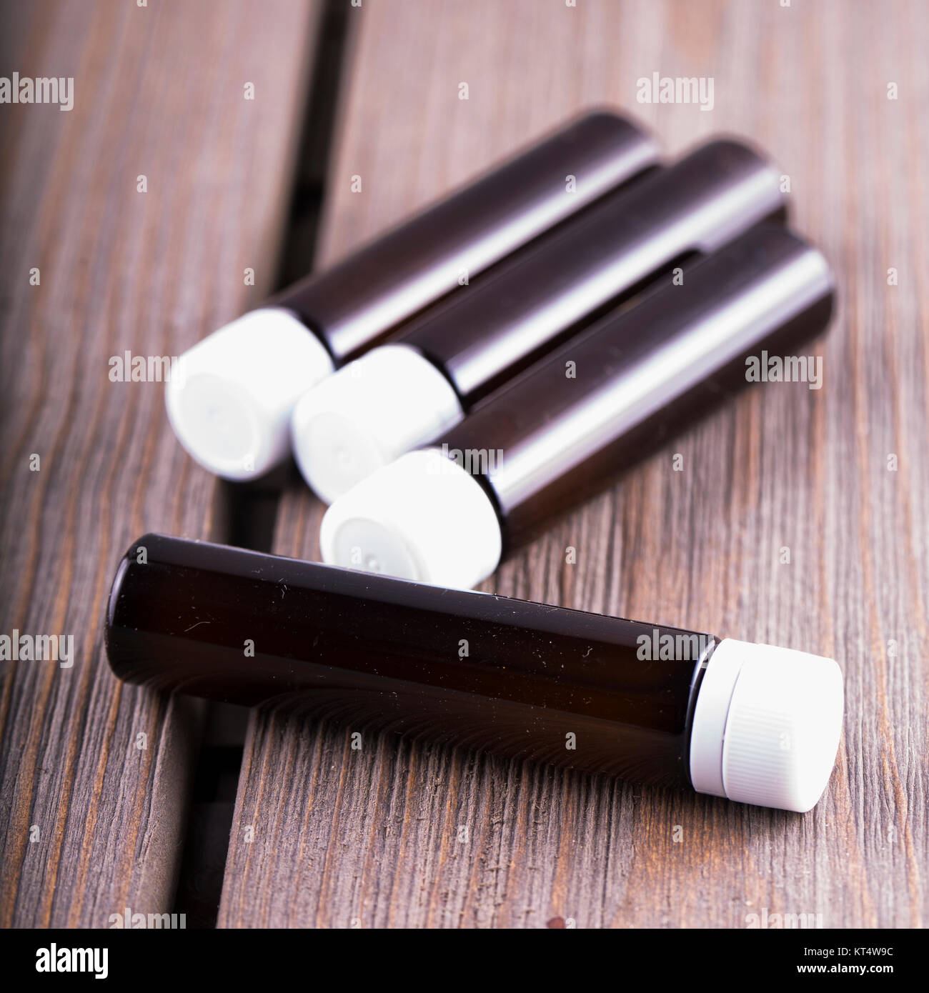 Vials over table Stock Photo - Alamy
