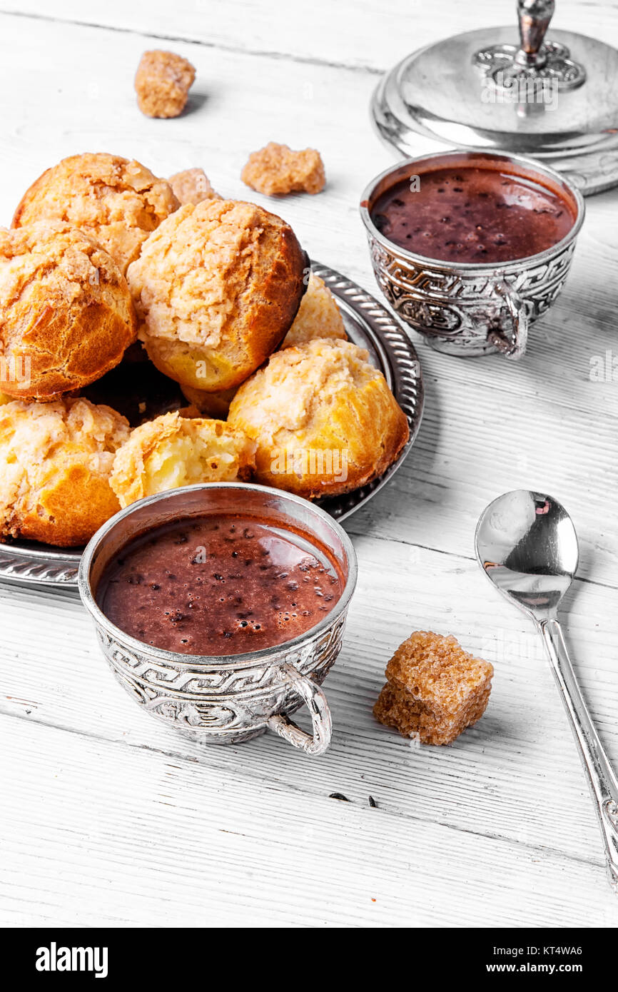Homemade profiteroles dessert and cup hot chocolate Stock Photo - Alamy