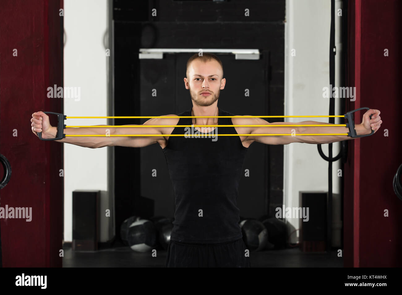 An Athlete Man Working With Stretch Band Stock Photo - Alamy
