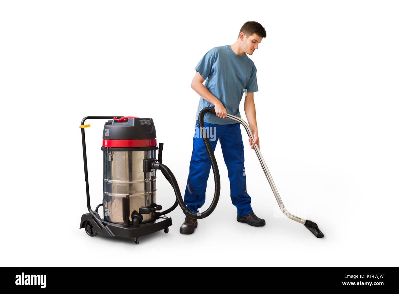Male Worker Cleaning With Vacuum Cleaner Stock Photo - Alamy