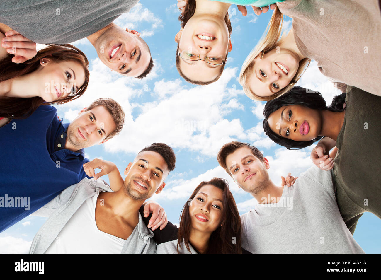 Confident College Students Forming Huddle Stock Photo - Alamy