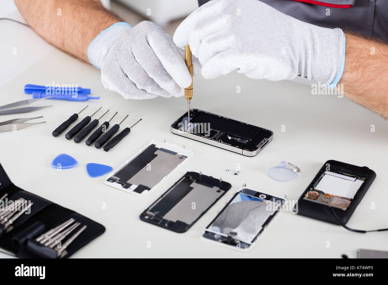 Person's Hand Repairing Cellphone Stock Photo - Alamy