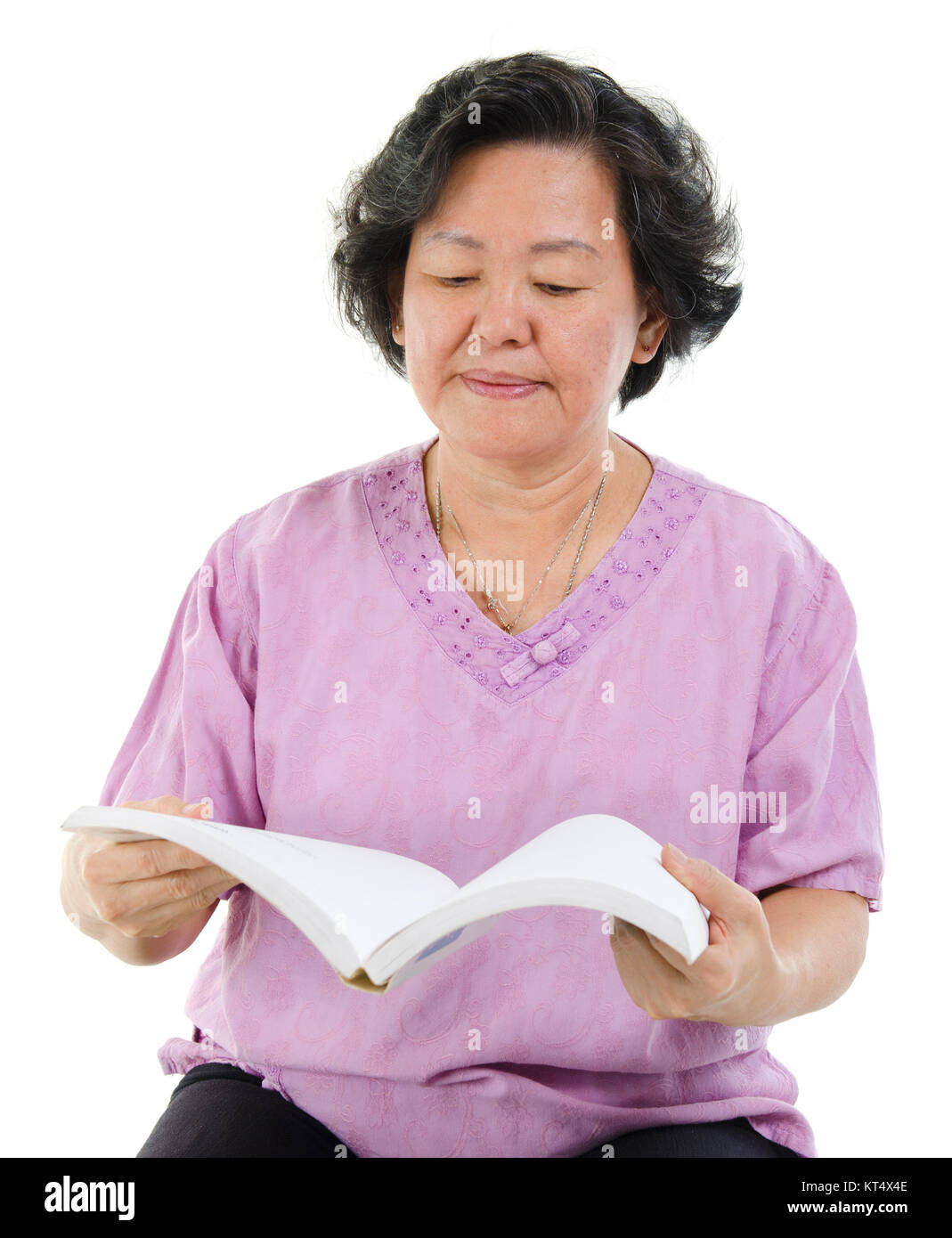 Senior adult woman reading book Stock Photo - Alamy