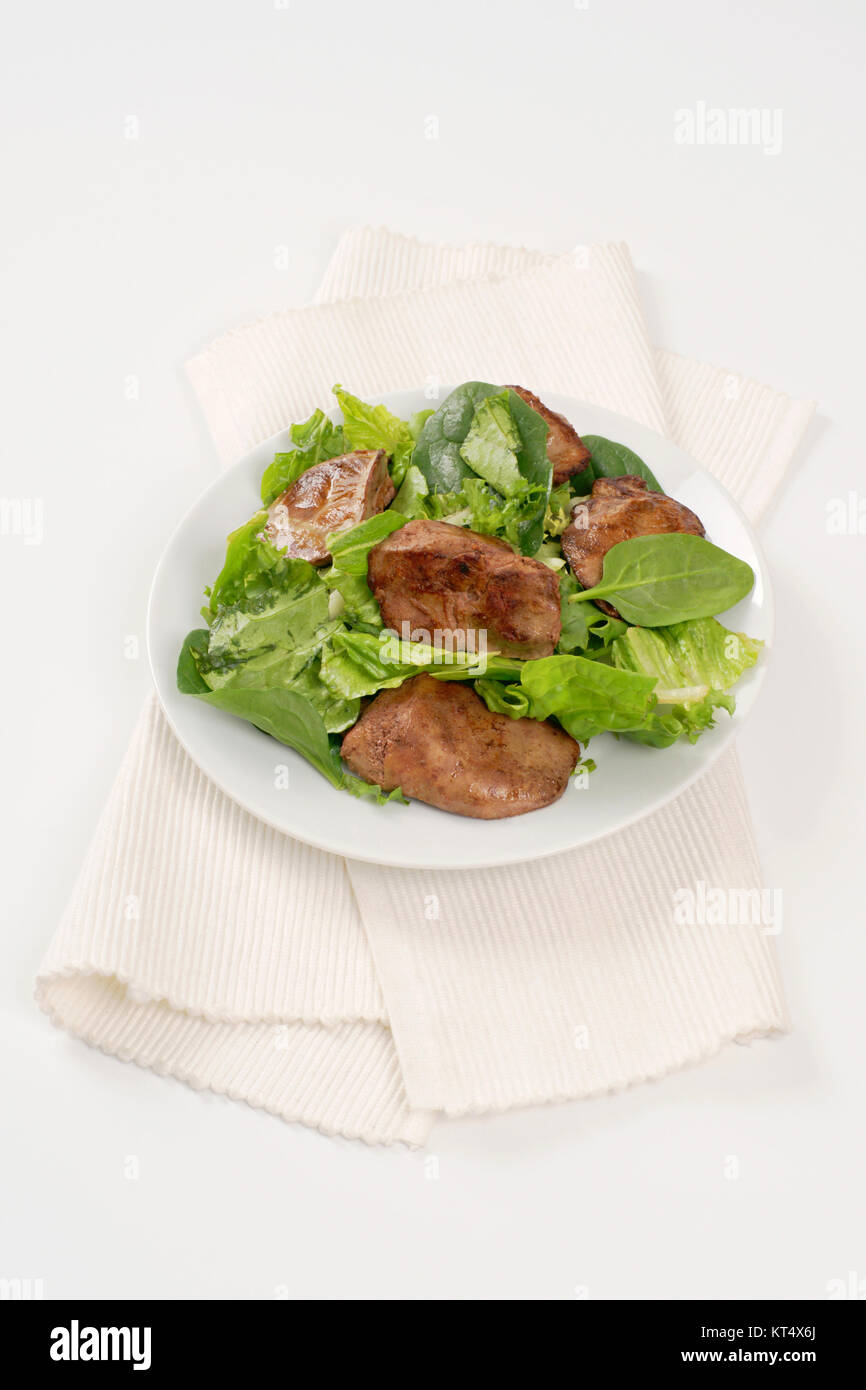 pan fried liver with greens Stock Photo - Alamy