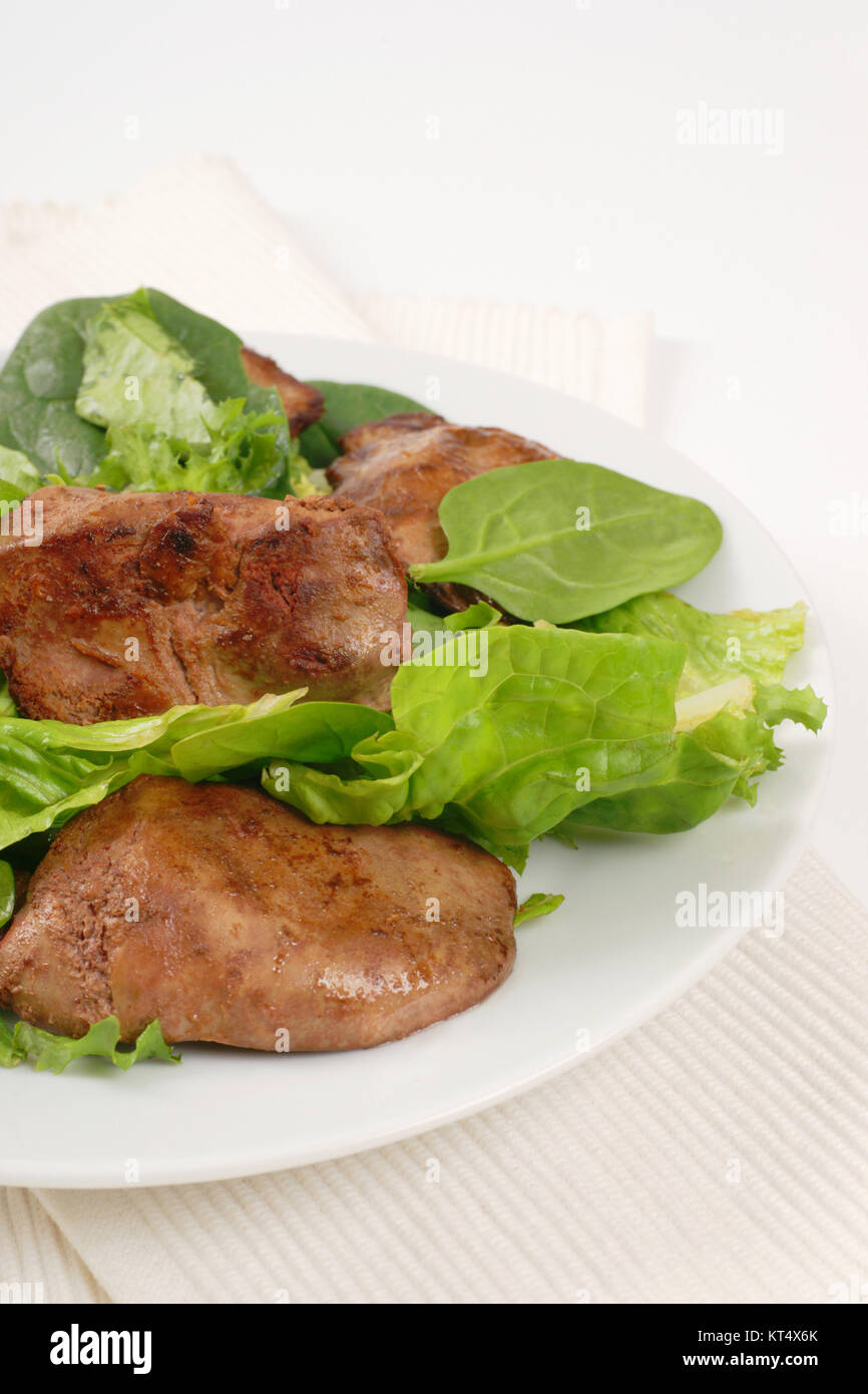 pan fried liver with greens Stock Photo - Alamy