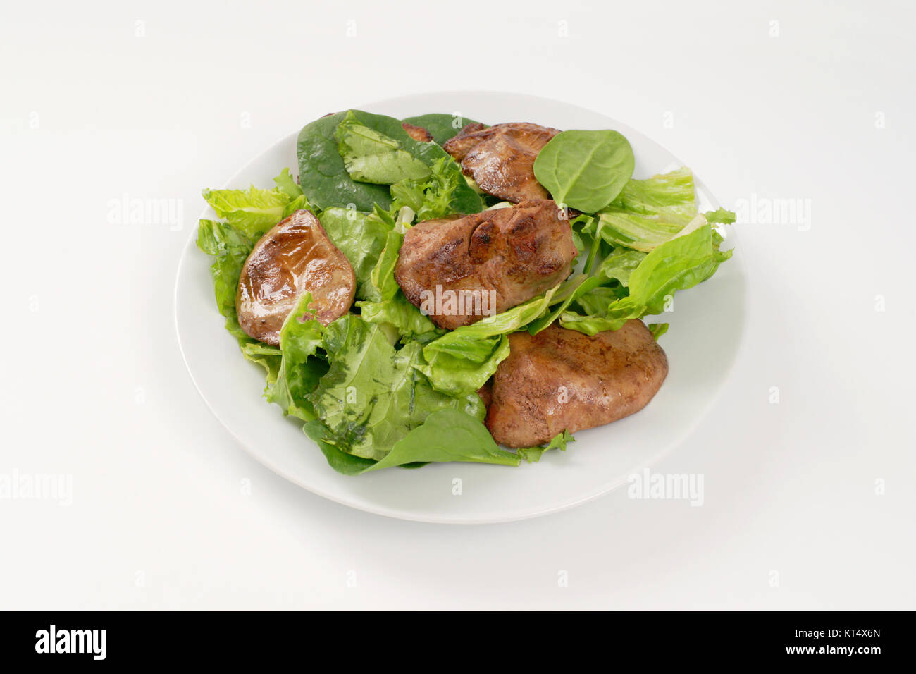 pan fried liver with greens Stock Photo - Alamy