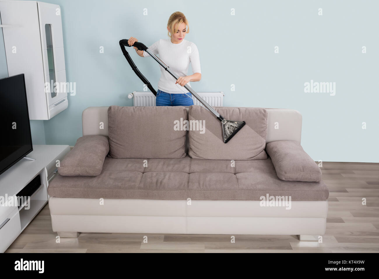 Woman Cleaning The Living Room Stock Photo - Alamy