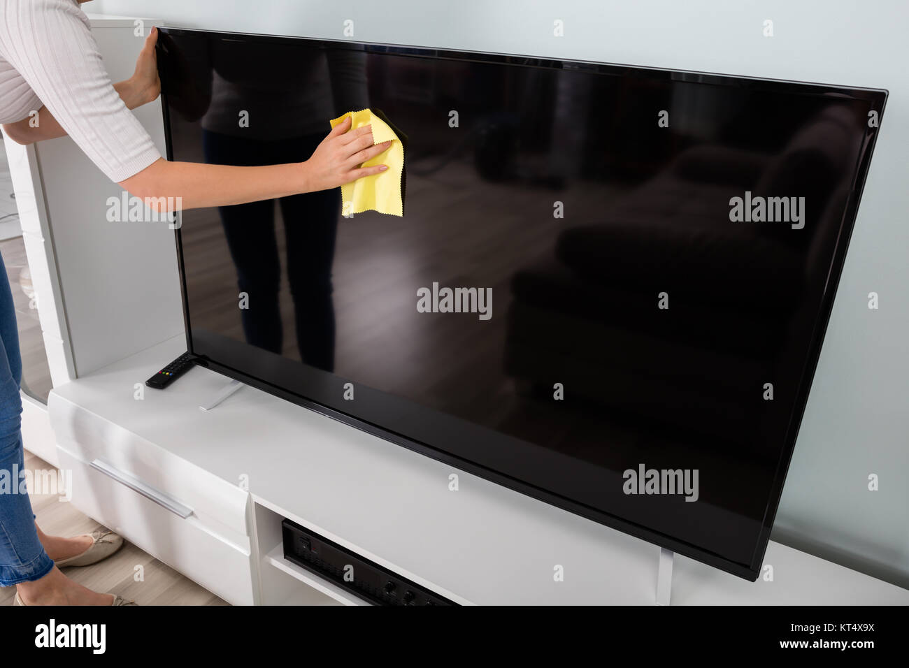 Woman Cleaning Television Stock Photo - Alamy