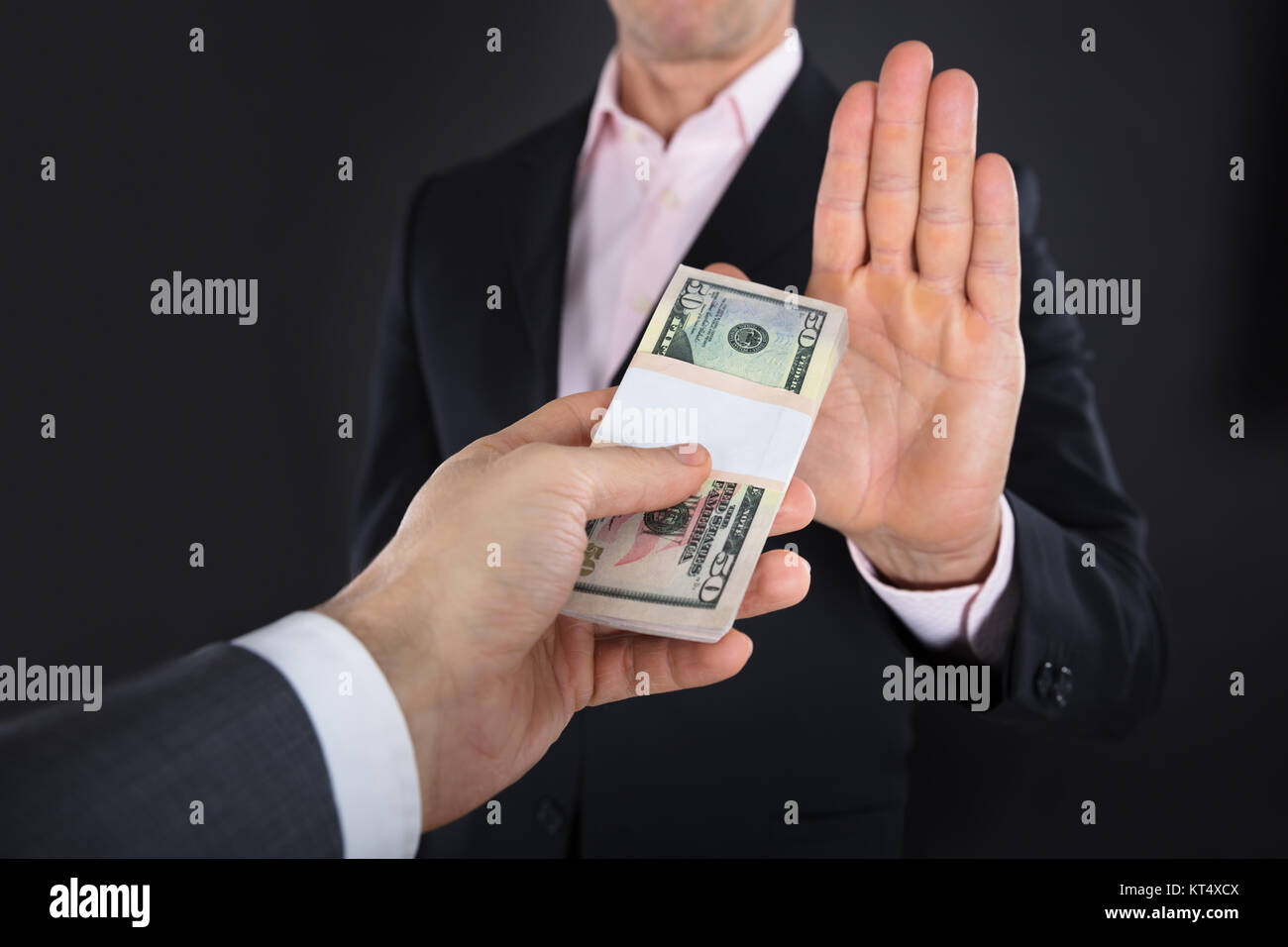 Businessman Refusing To Take A Bribe Stock Photo - Alamy