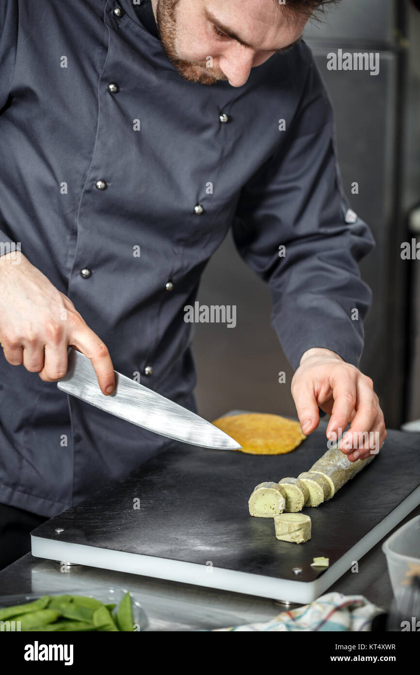 Chef cutting compound butter Stock Photo - Alamy