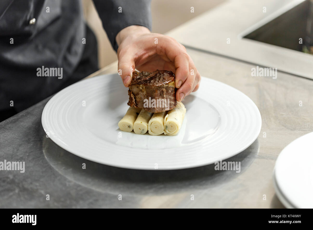 Chef preparing plate Stock Photo - Alamy