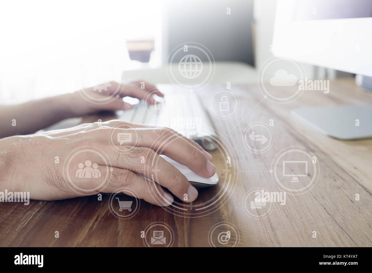 Man's hands using computer with social connect icons Stock Photo - Alamy