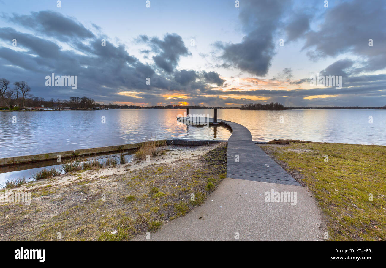 Sunset over Floating swimming jetty on the banks of lake ...