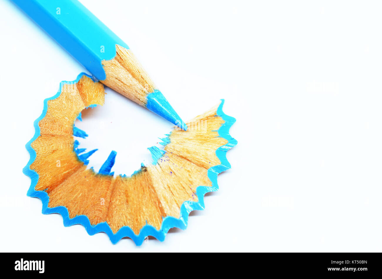 Sharpened blue color pencil and wood shavings Stock Photo - Alamy