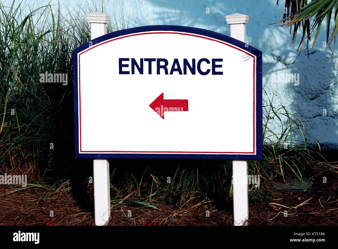 sign entrance middle direction of entry on the right side white blue ...