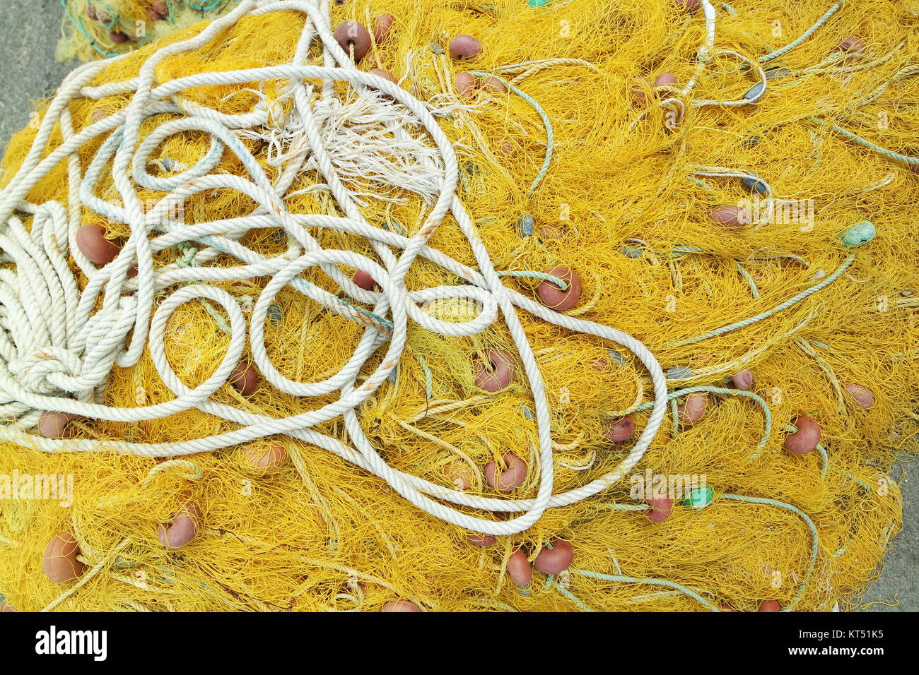 yellow fishing nets Stock Photo - Alamy