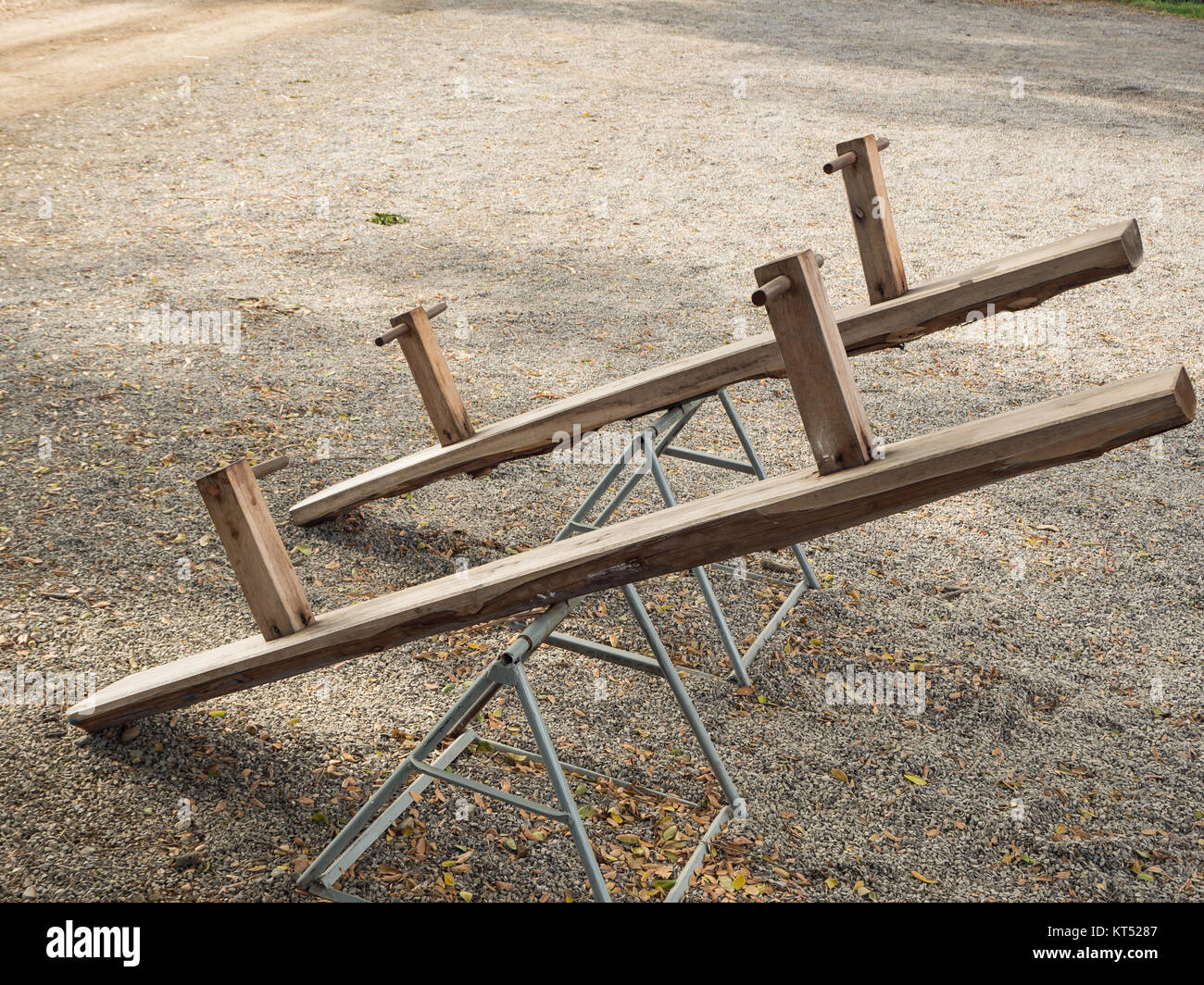 Wooden rocking chair in the park Stock Photo - Alamy