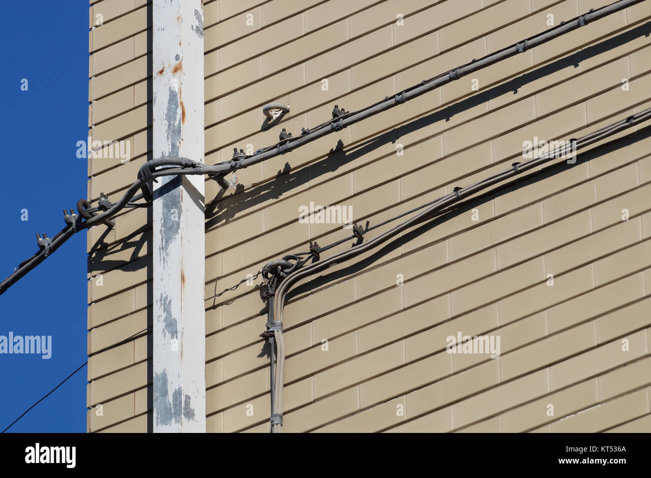 Messy cables and electrical boxes in a wall .Wiring of the facade Stock ...