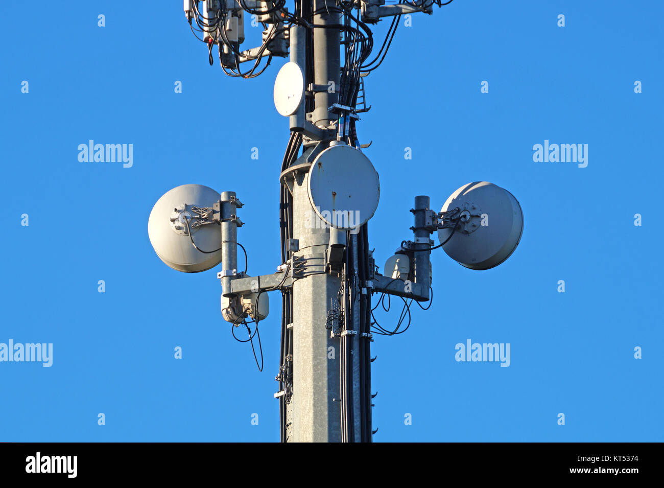 Modern Cellular Tower - Communication Tower on Blue Sky. Vertical ...