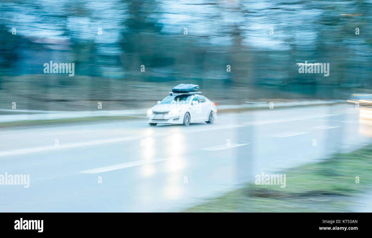 car driving fast Stock Photo - Alamy