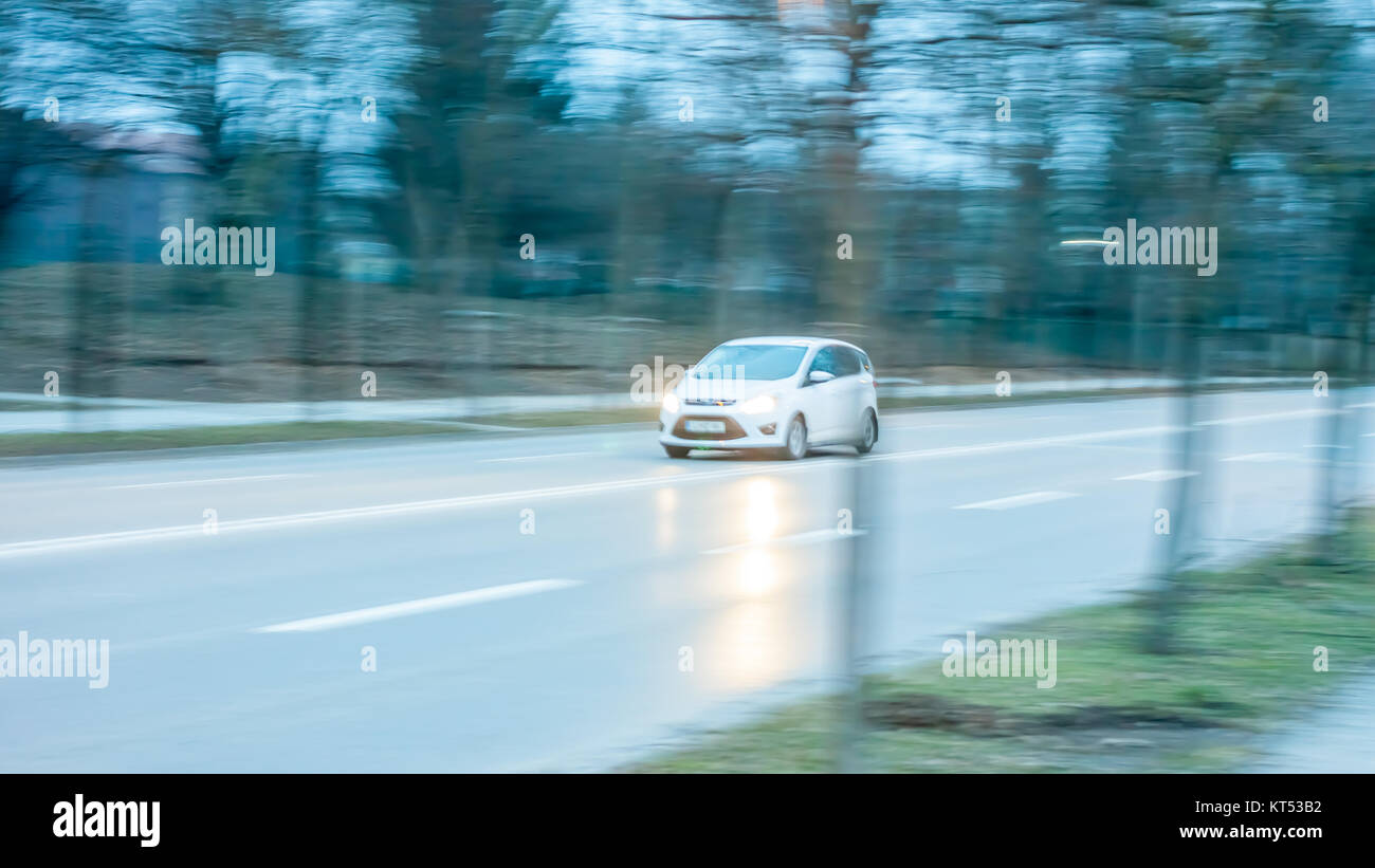car driving fast Stock Photo - Alamy