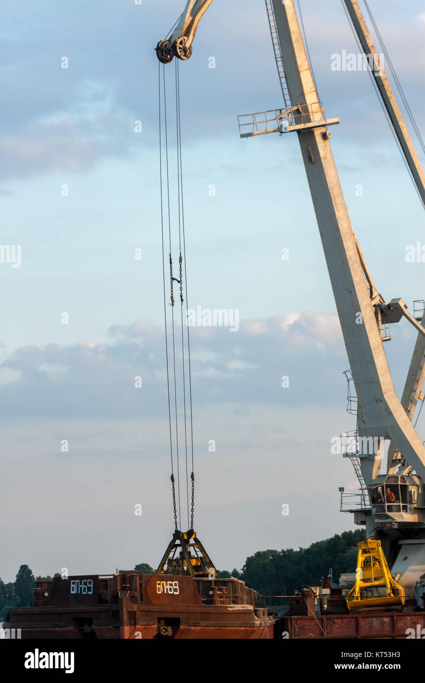 Cargo crane working in small hi-res stock photography and images - Alamy