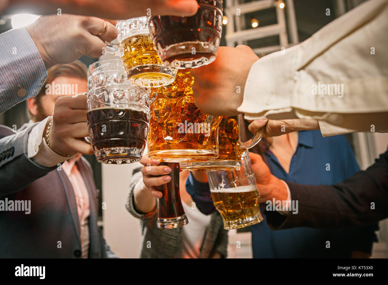 Group of friends enjoying evening drinks with beer Stock Photo - Alamy