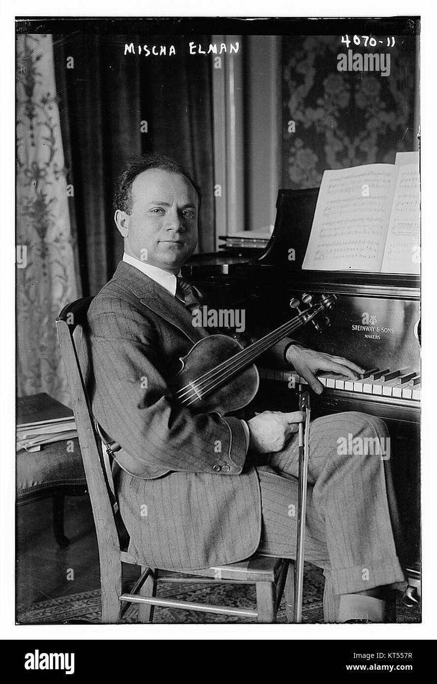 Mischa Elman, a renowned violinist, captured with his violin. Elman is ...