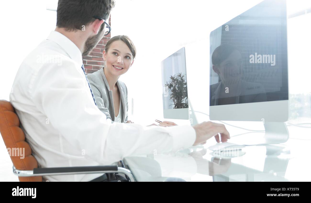 creative designers sitting behind a Desk Stock Photo - Alamy