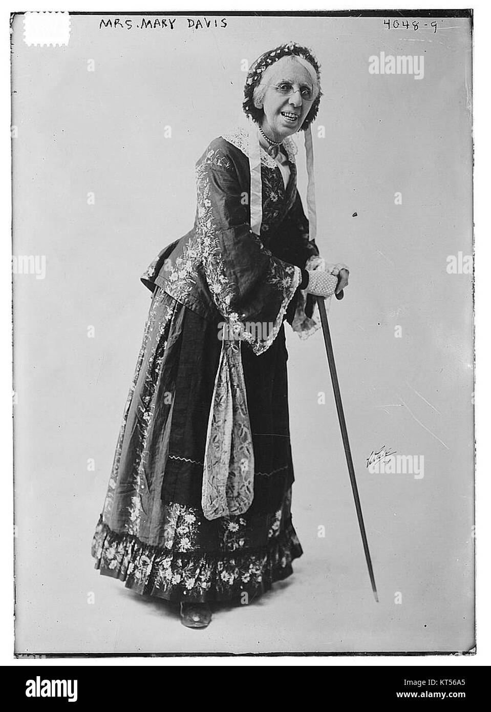 Mrs. Mary Davis is a figure captured in a historical photograph. The ...