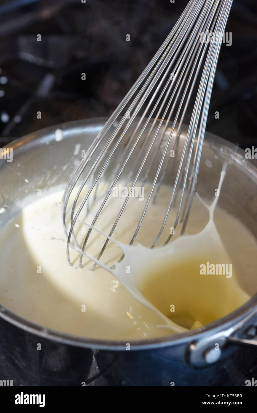 A splash of milk in a saucepan Stock Photo - Alamy