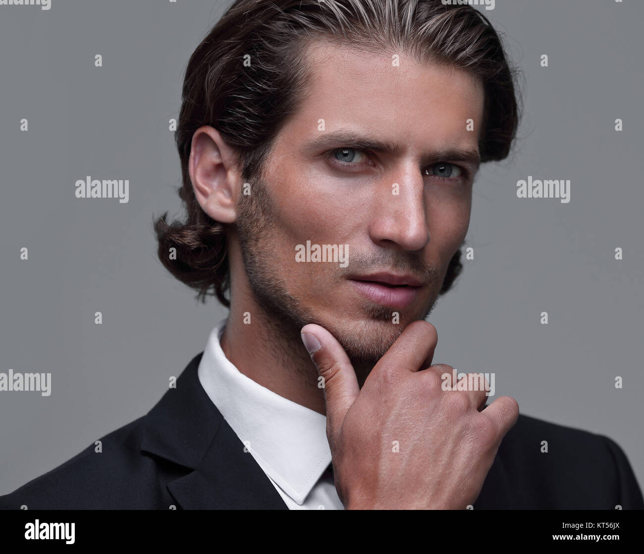 face of confident young businessman Stock Photo - Alamy