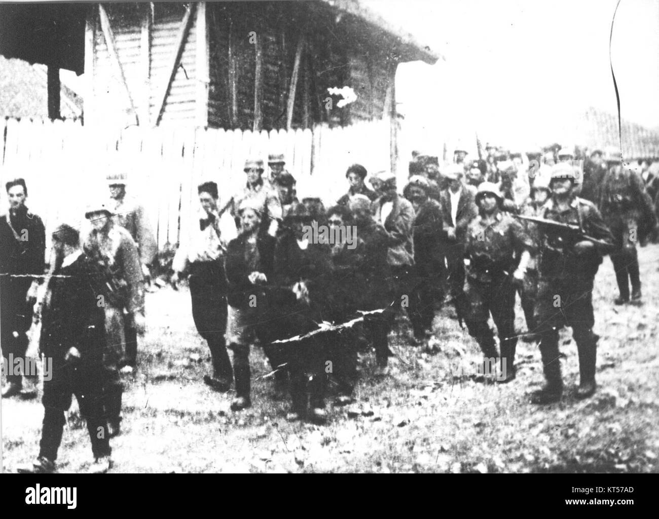 This image from 1941 shows German soldiers executing partisans during ...
