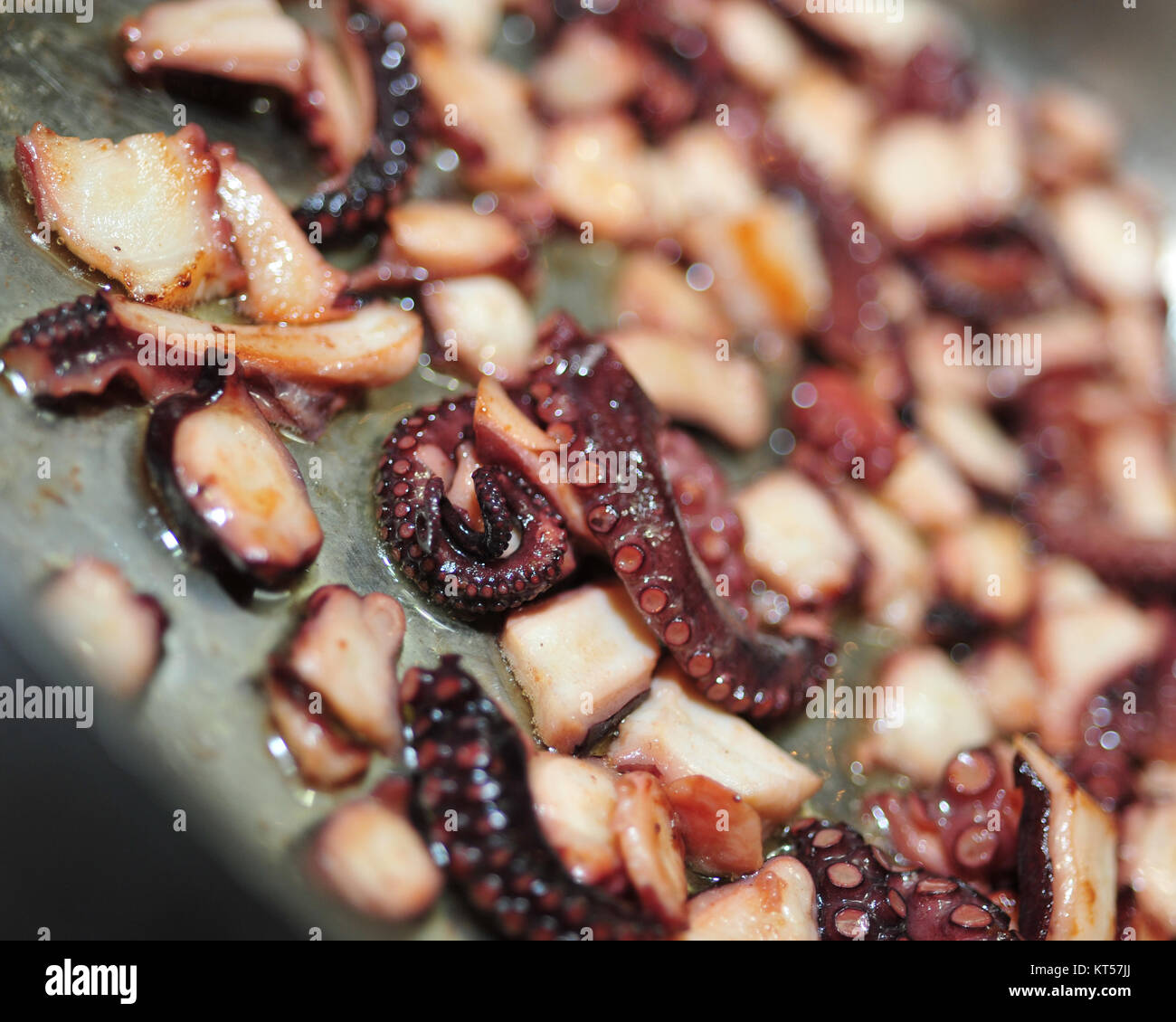 Octopus frying in a pan Stock Photo - Alamy