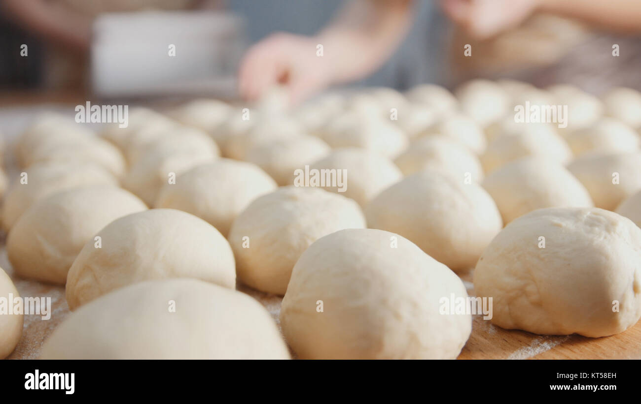 Cook is shaping meat pies by hands in the bakery Stock Photo - Alamy