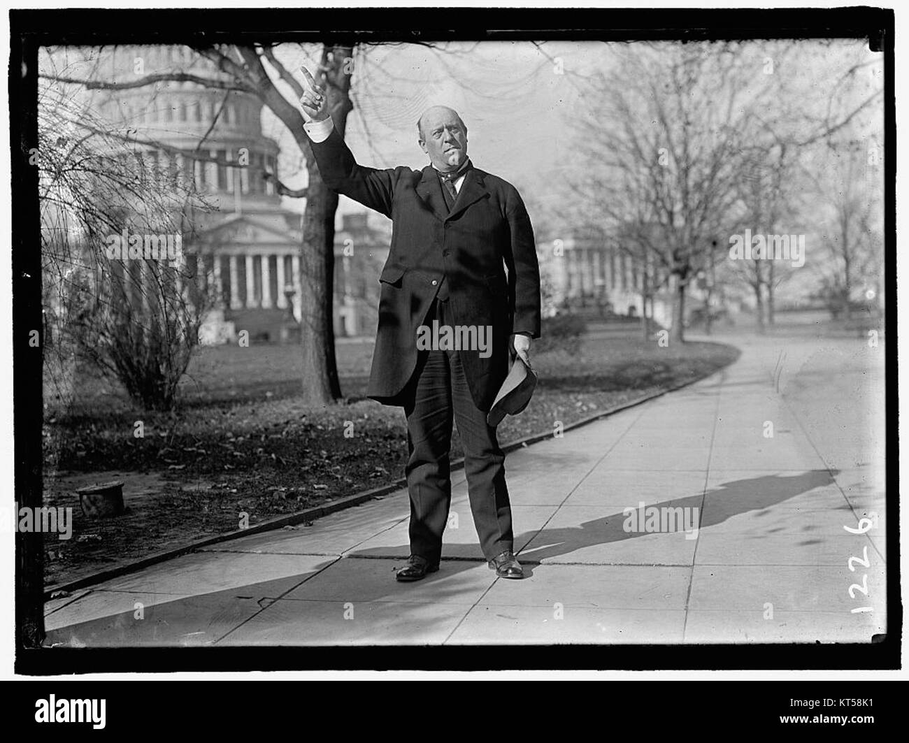 Ollie M. James, an American figure, is shown standing in a formal ...