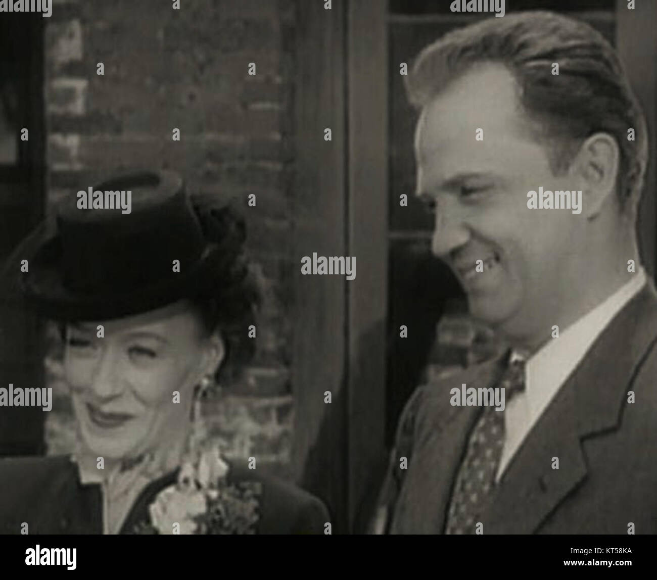 This image features Ona Munson and Walter Sande in a scene from the ...