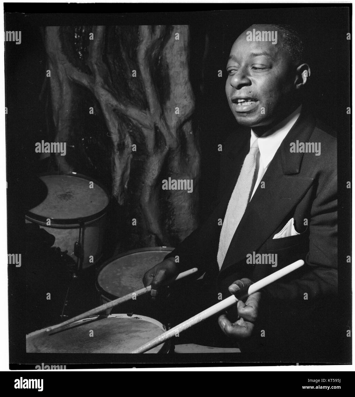 This portrait captures Baby Dodds, an influential jazz drummer, in a ...