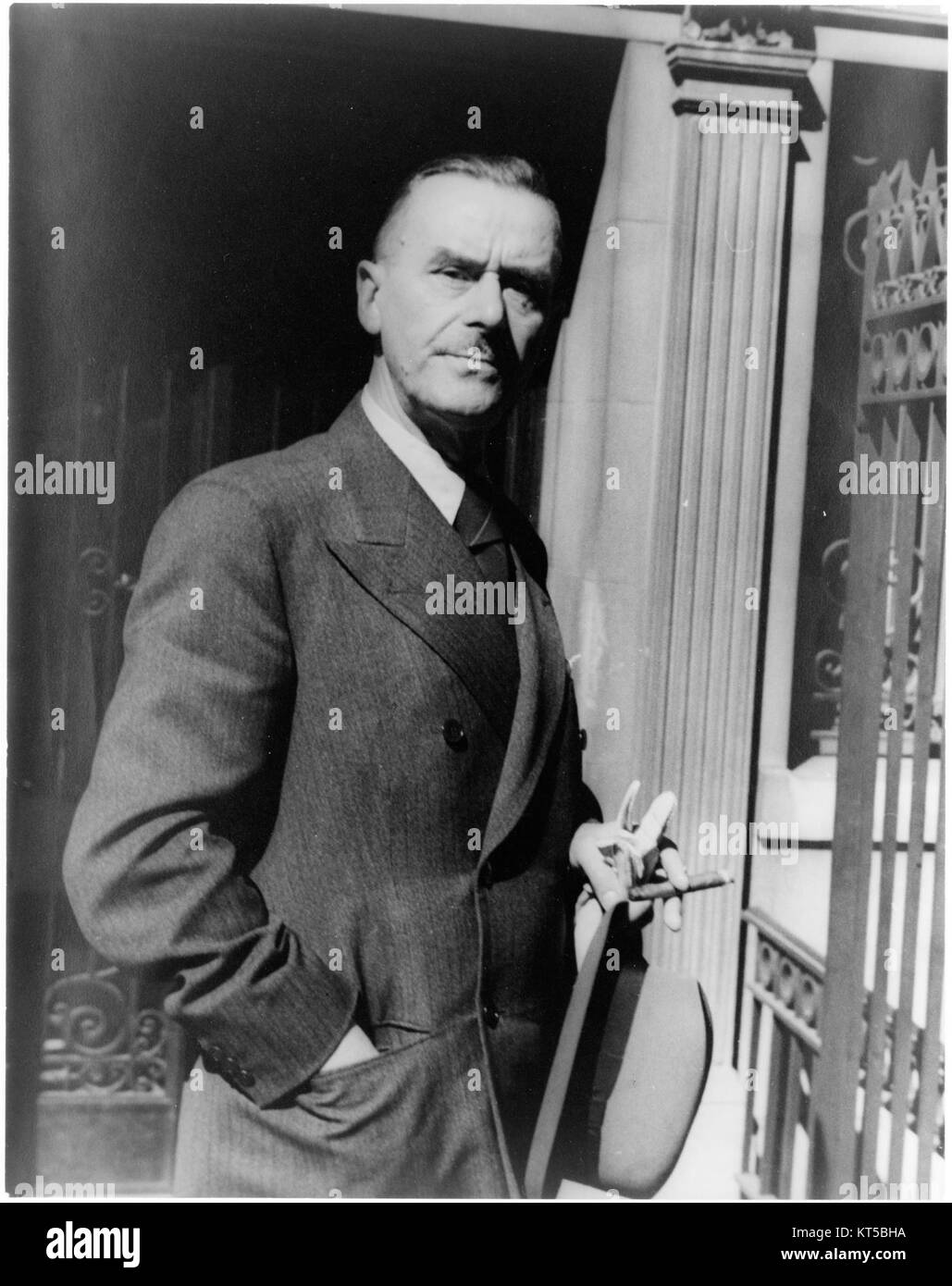 This portrait captures Thomas Mann, the renowned German author, holding ...