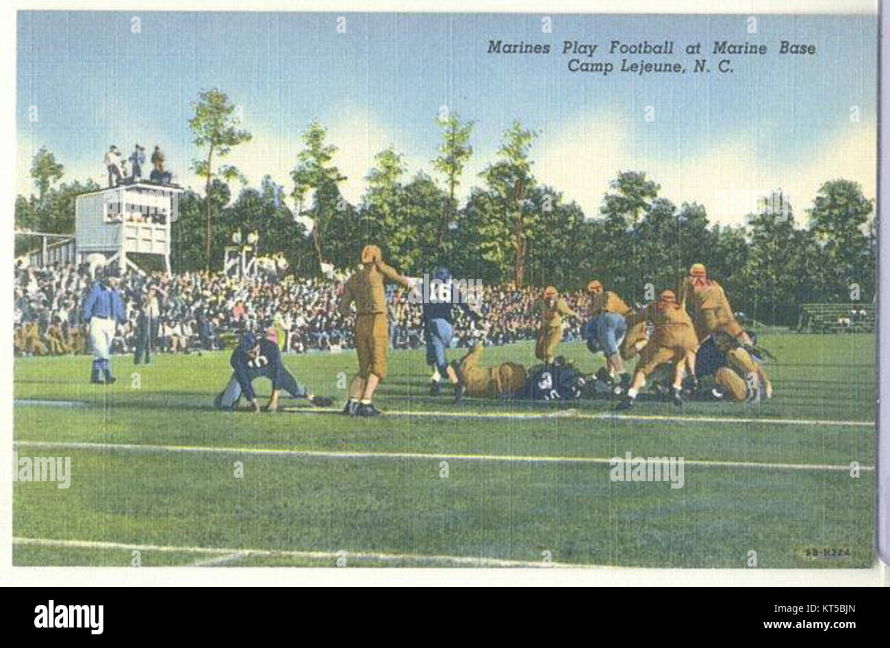 A 1940 postcard capturing U.S. Marines engaged in a game of football ...