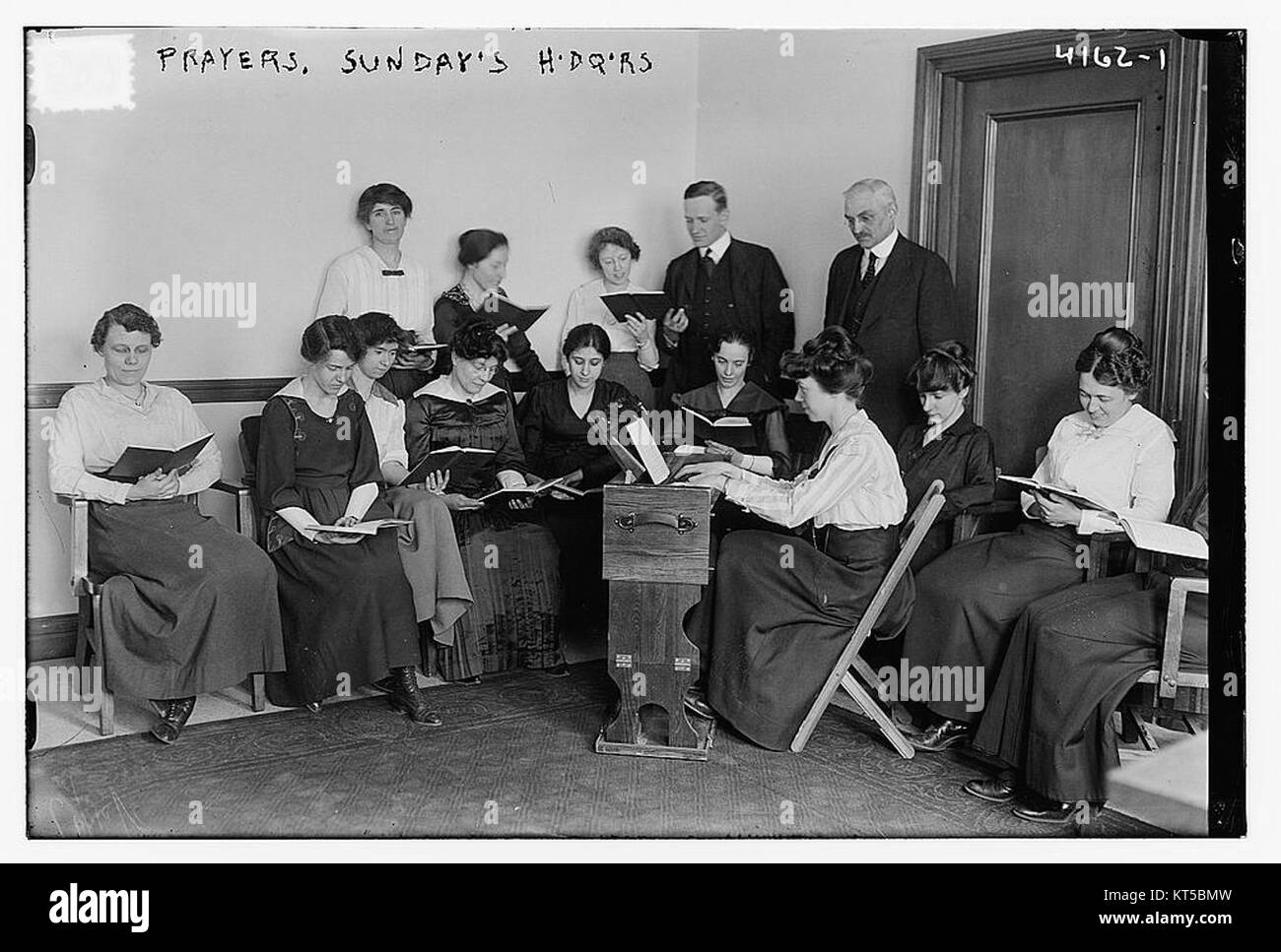 The image represents a moment of prayer at a religious headquarters ...