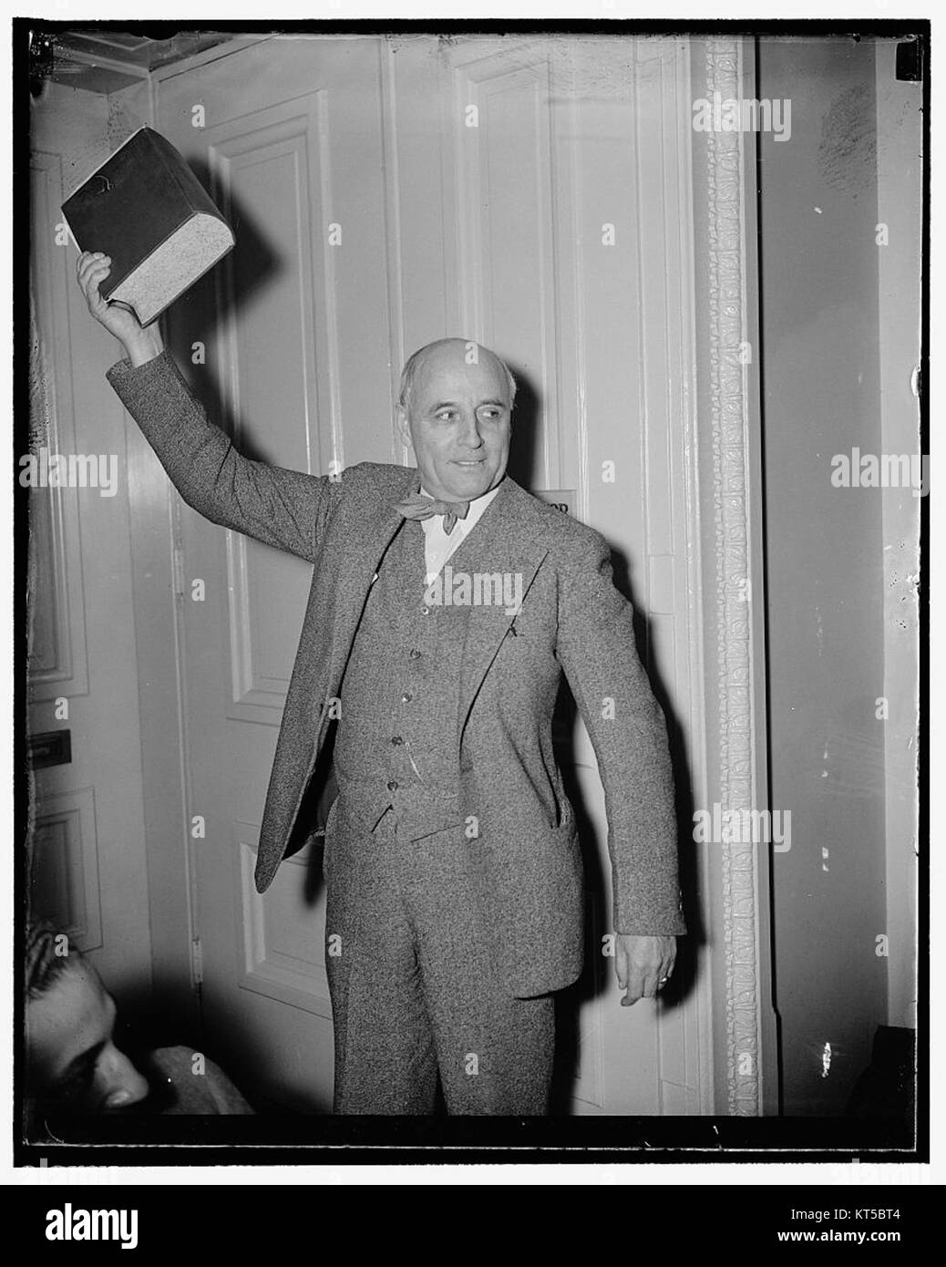 Andrew J. May, a historical figure, is depicted with a book, possibly ...
