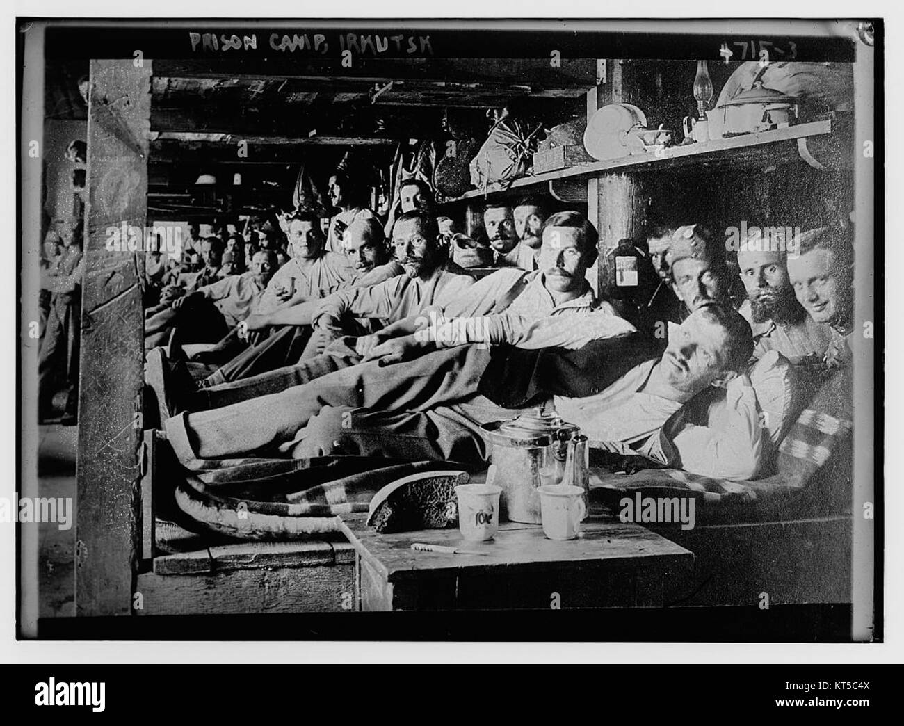 This photograph depicts a historical scene from a prison camp in ...