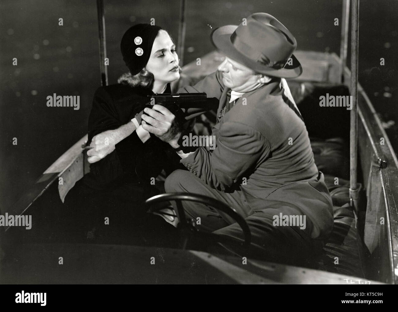 A publicity still from the 1949 film *Too Late for Tears*, featuring ...